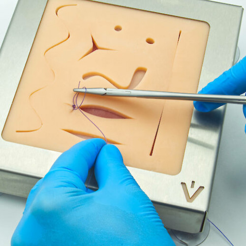 Skin training suture